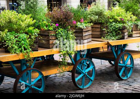 Various photos of the carts with flowers and greenery around Covent ...