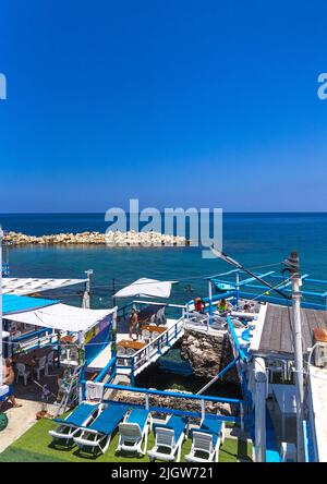 Seashore with blue water, North Governorate, Anfeh, Lebanon Stock Photo ...