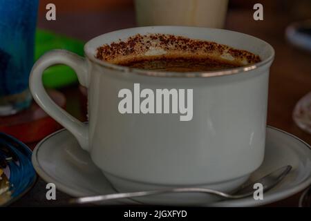 A cup of ground coffee with a slightly coarse grinded bean, a mood ...