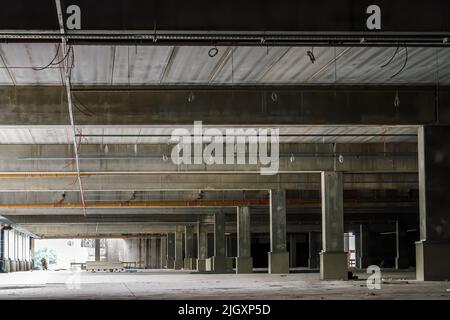 Underground parking lot under construction. Concrete interior of ...