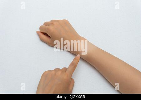 Watch marks on a woman's hand burned in the sun Stock Photo - Alamy