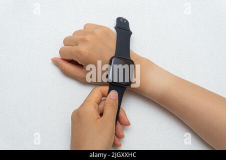Watch marks on a woman's hand burned in the sun Stock Photo - Alamy