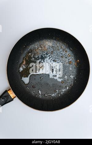 Old frying pan with a lot of grease Stock Photo - Alamy