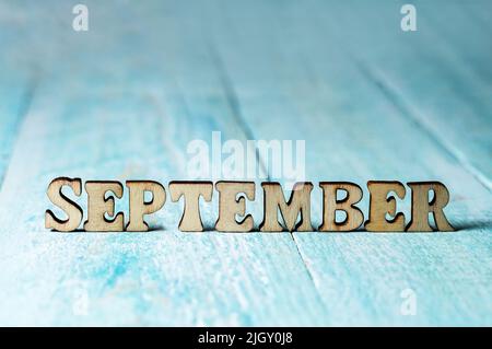 The month of January is large on a blue background. The names of the ...