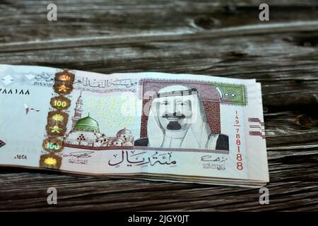 Stack of Saudi Arabia 100 SAR one hundred riyals cash money banknote ...