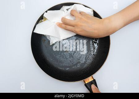 Old frying pan with a lot of grease Stock Photo - Alamy