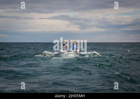 Boating on Great Bear Lake, in the northern Indigenous community of ...