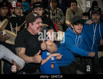 Indigenous Dene male youth playing traditional handgames in northern ...
