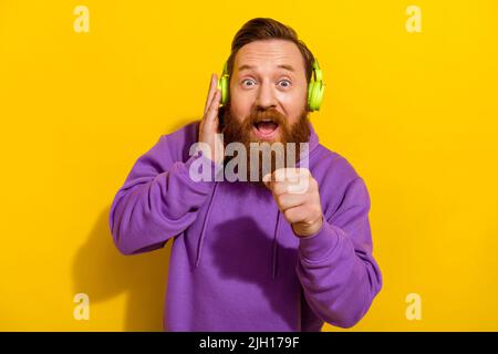 Photo of sweet funky guy dressed white sweater arms sides jumping high ...