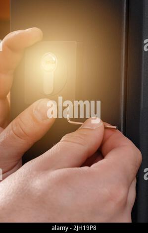 Hex key and installation of door lock and handle, close-up installation ...