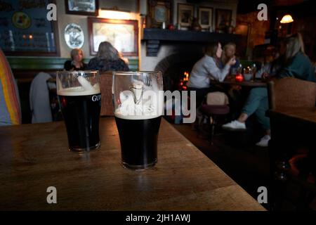 two pints of guinness inside whites tavern belfast northern ireland uk ...
