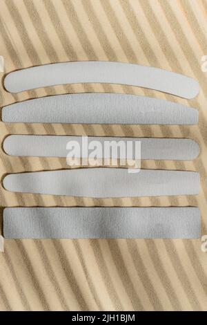 Set of gray nail files of different shapes and different stiffness ...