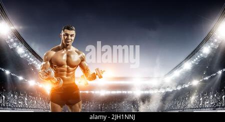 Male runner against dark background Stock Photo - Alamy