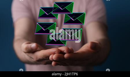 A 3D render of express envelopes near a hand Stock Photo - Alamy