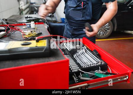 Professional toolbox with modern tools at garage Stock Photo - Alamy