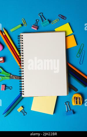 Vertical composition of school equipment with notebook with copy space ...