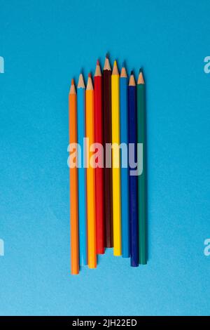 Composition of colorful crayons on blue surface with copy space Stock ...