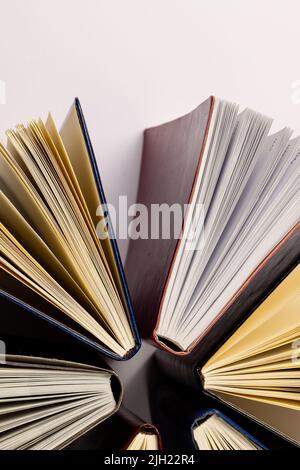 Image of central composition with books standing on white surface Stock ...