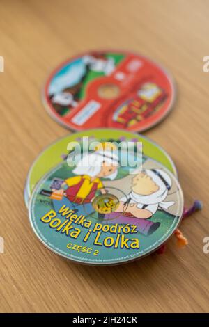 A vertical shot of Polish movie video compact discs for children on a ...