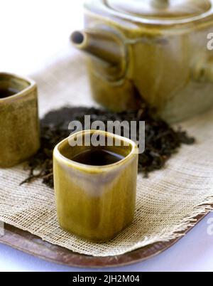 Close-up of herbal tea with teapot on table Stock Photo - Alamy