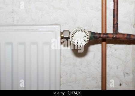 radiators with thermostat and old copper pipes, a heating system Stock ...