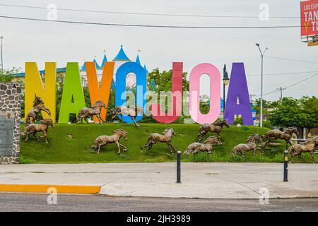 Monumental colored letters and horse stampede sculpture at the entrance ...