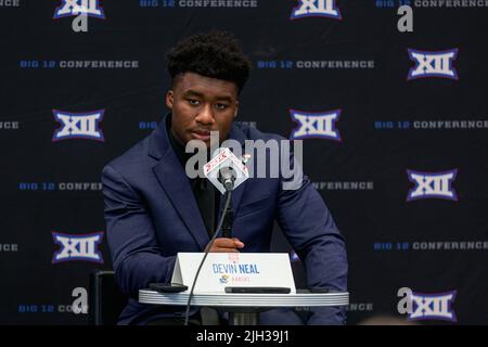 Kansas running back Devin Neal (4) gets past BYU linebacker Max Tooley ...