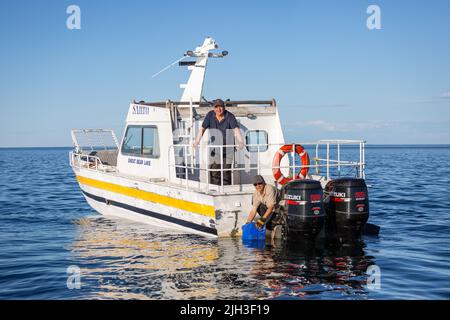 Boating on Great Bear Lake, in the northern Indigenous community of ...