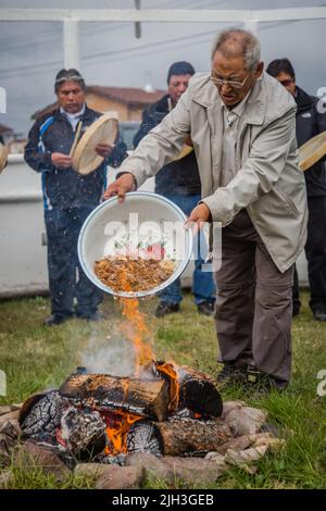 Indigenous Dene men at traditional fire feeding ceremony, in the ...