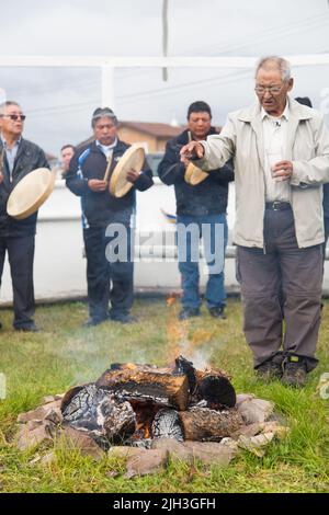 Indigenous Dene men at traditional fire feeding ceremony, in the ...
