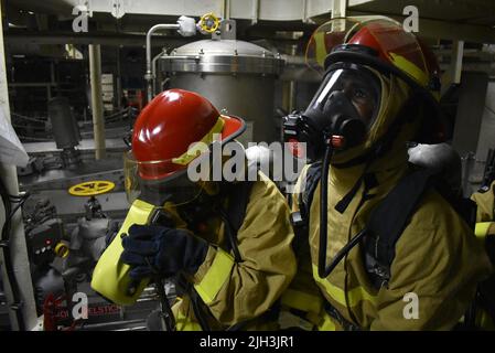 US Navy Mineman 1st Class assigned to Mobile Mine Assembly Detachment ...