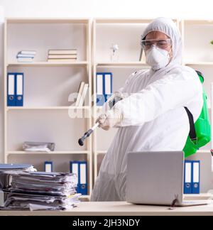 Professional contractor doing pest control at kitchen Stock Photo - Alamy