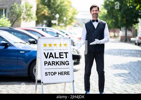 Valet Parking Hotel Service. Man Driver Standing Stock Photo - Alamy