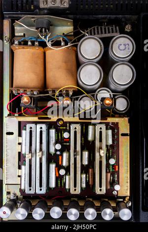 Inside view of turntable with amplifier, capacitors, coils and other ...