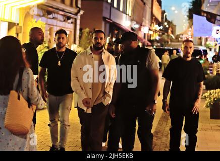 *CAPTION CORRECTION* Artist Drake with entourage on Biblioteksgatan ...