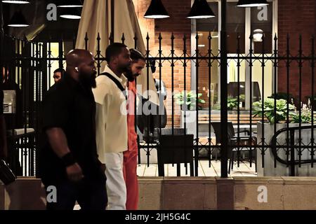 *CAPTION CORRECTION* Artist Drake leaves Grand Hotel through a back ...