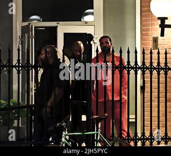 *CAPTION CORRECTION* Artist Drake leaves Grand Hotel through a back ...