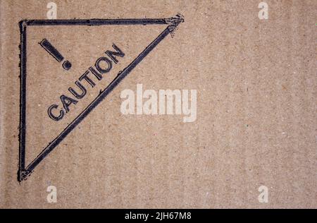 View of cardboard with handle with care sign. Package box with symbol ...