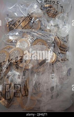 Bagged up one pound coins Stock Photo - Alamy