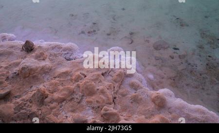 Large Salt accumulated on the shore of the Dead sea. Deposits of mineral salts, typical ...