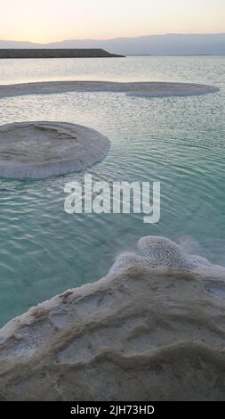 Large Salt accumulated on the shore of the Dead sea. Deposits of mineral salts, typical ...