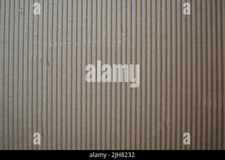 Dark brown color corrugated cardboard box textured background with ...