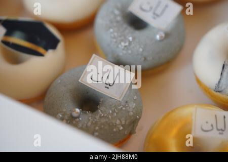 Graduation mini doughnuts for catering Stock Photo - Alamy