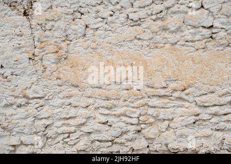 Old traditional limewashed stone wall, white rustic background or ...