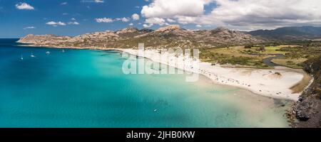 Holidaymakers enjoying the sunshine and turquoise Mediterranean sea in ...