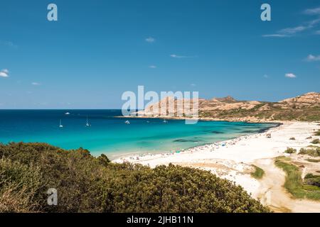 Holidaymakers enjoying the sunshine and turquoise Mediterranean sea in ...