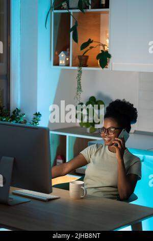Woman looking at mobile phone at night Stock Photo - Alamy