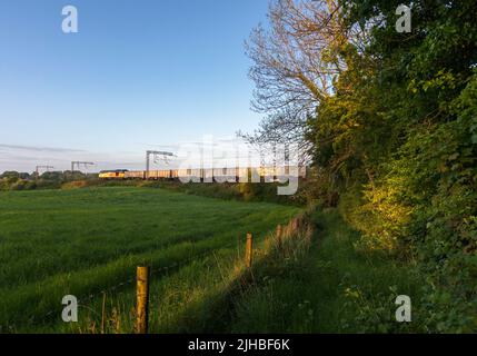Freight train carrying aggregates in the countryside on the west coast ...