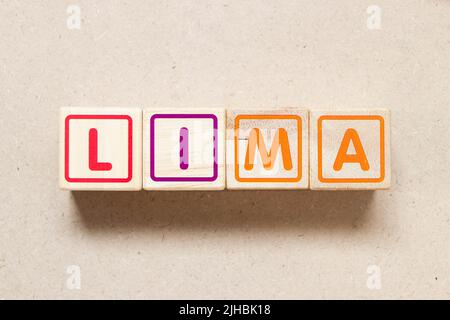 Letter block in word Lima on wood background Stock Photo - Alamy