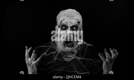 Aggressive Halloween zombie man asking reason of failure feeling bored ...